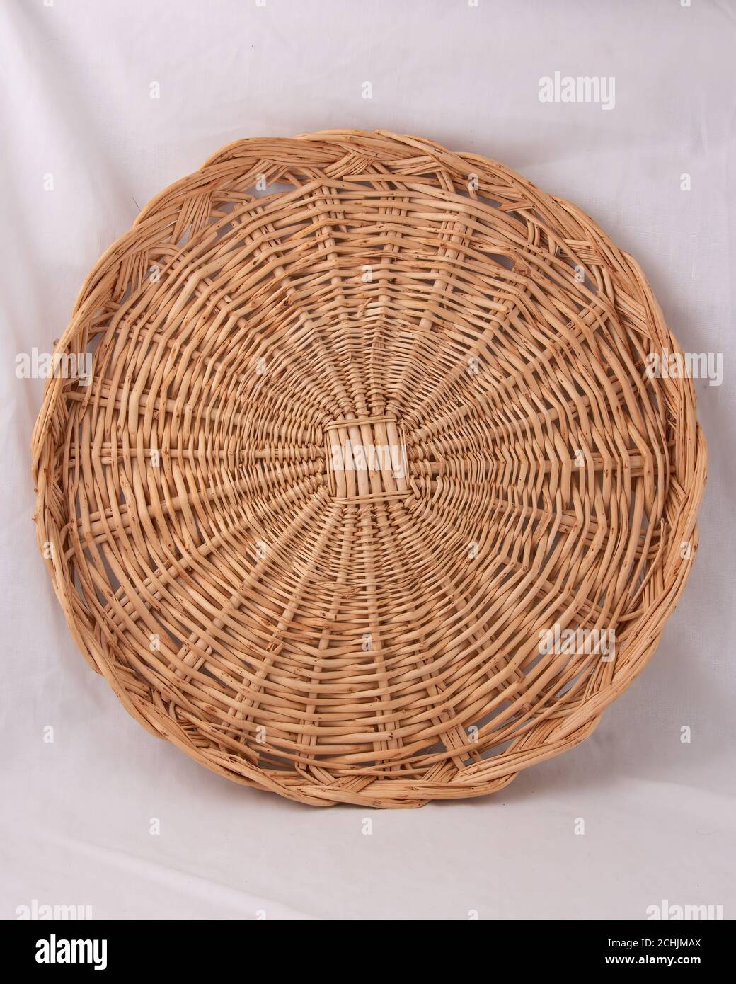 Handmade wicker work basket tray isolated on white Stock Photo - Alamy