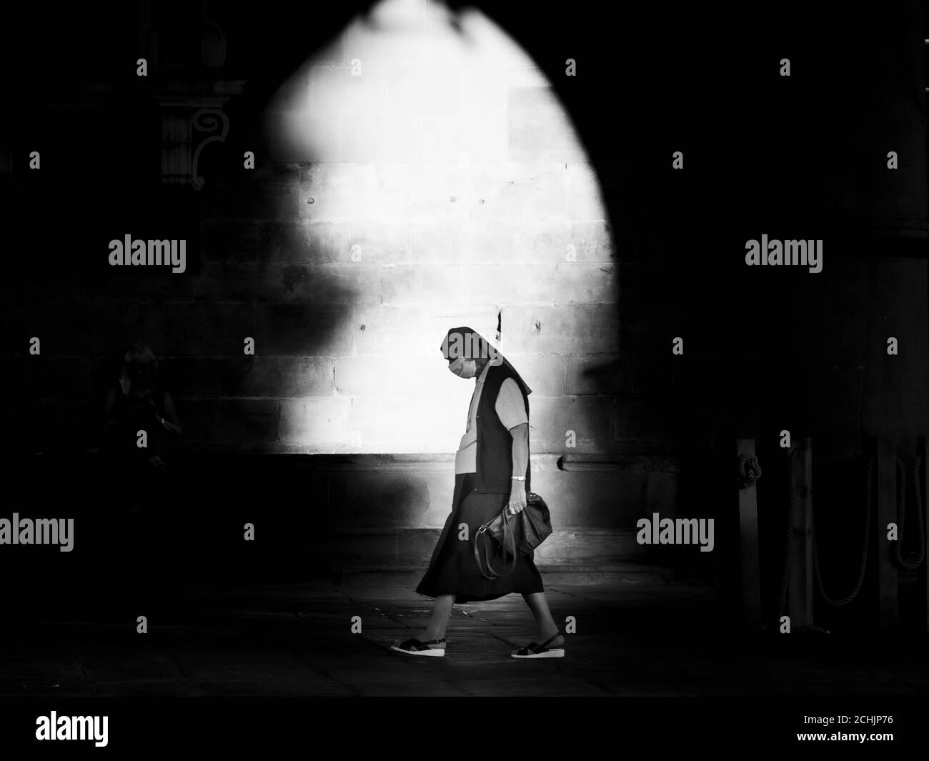 Nun walking in the street Stock Photo - Alamy