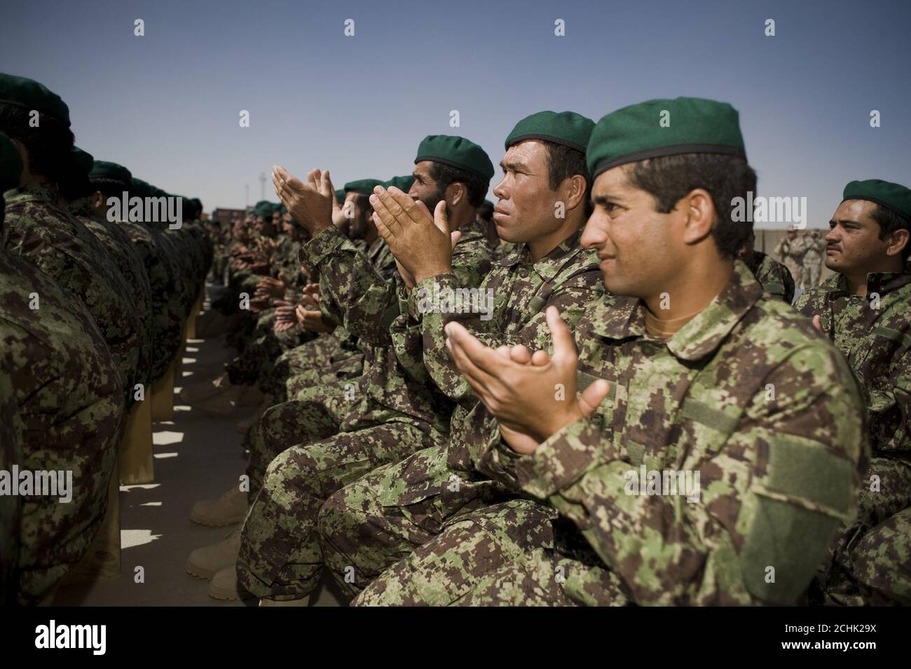 Soldiers of the Afghan National Army (ANA) take part in a graduation ...