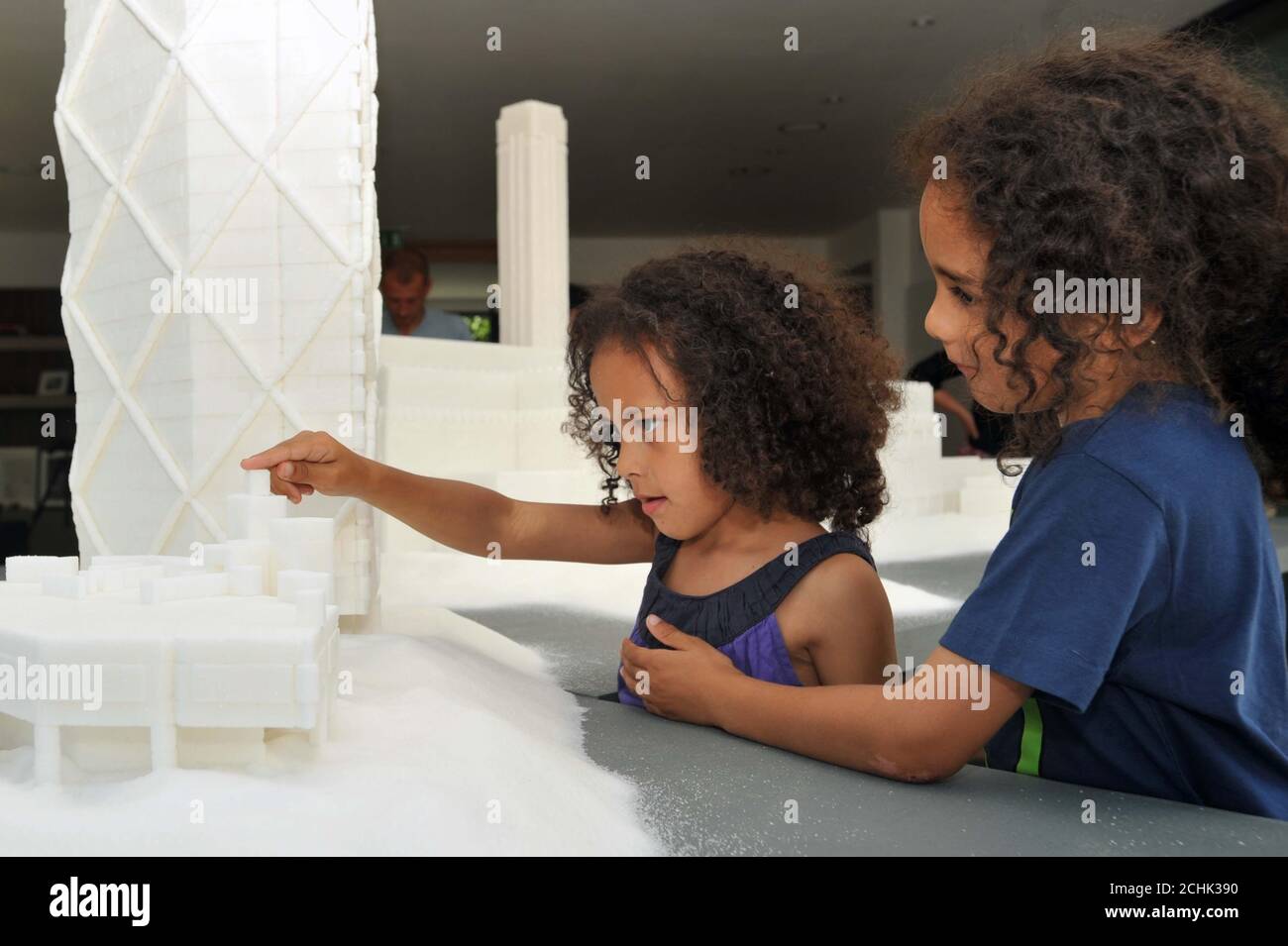 Six-year-old twins Kenya (left) and Max Lord add a sugar cube Belfast ...
