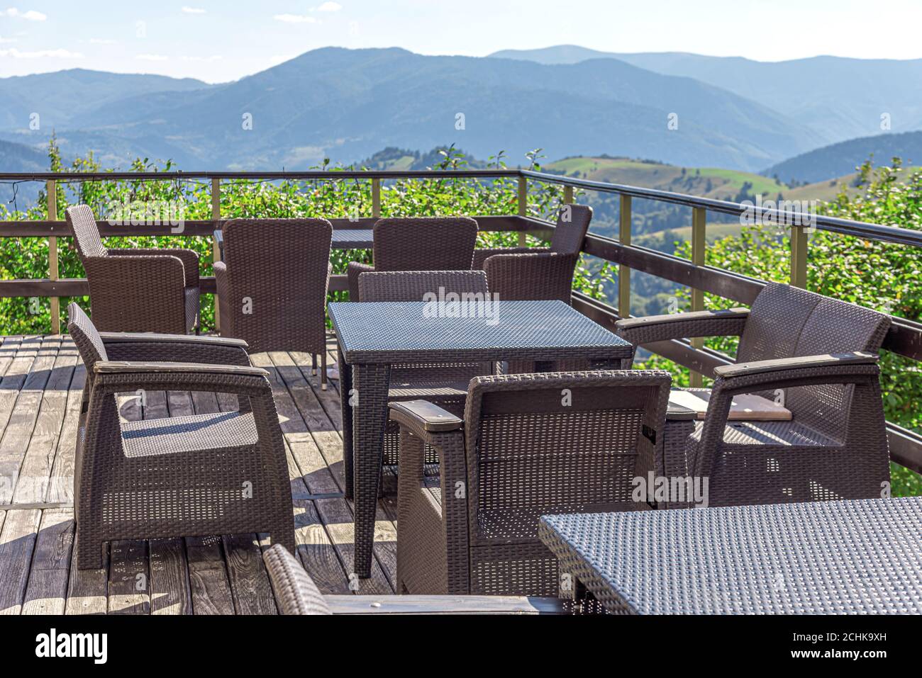 Terrace with tables and chairs with beautiful mountain views. Cafe ...
