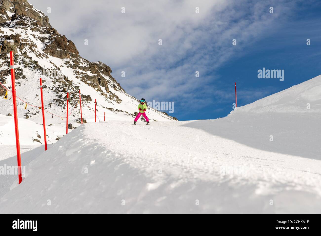 Active adorable preschooler caucasian smiling kid girlriding fast ski ...
