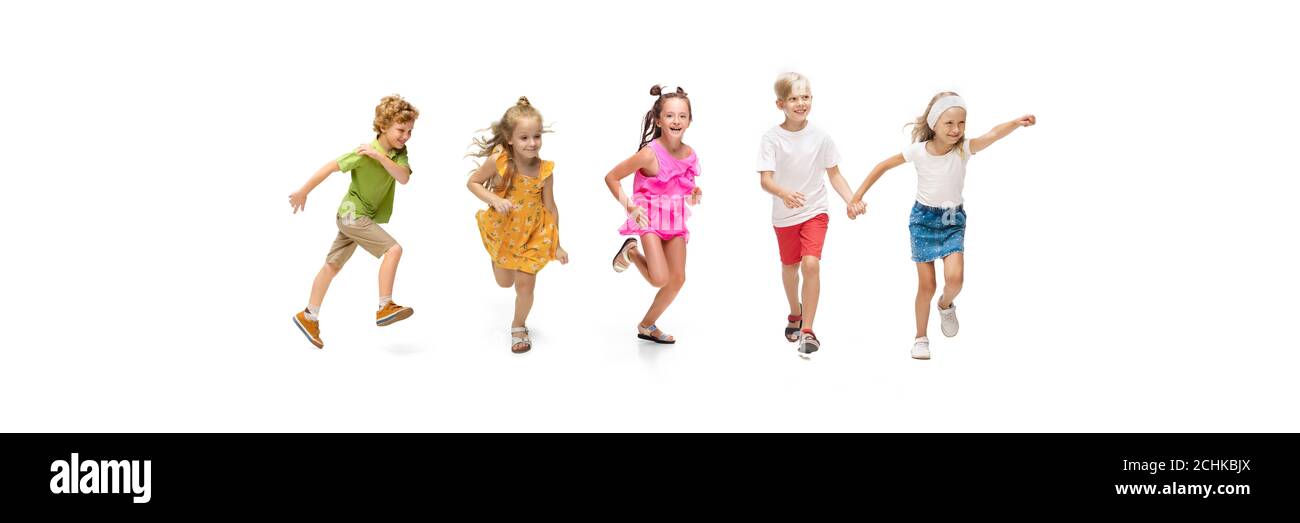 Happy children, little and emotional caucasian kids jumping and running ...