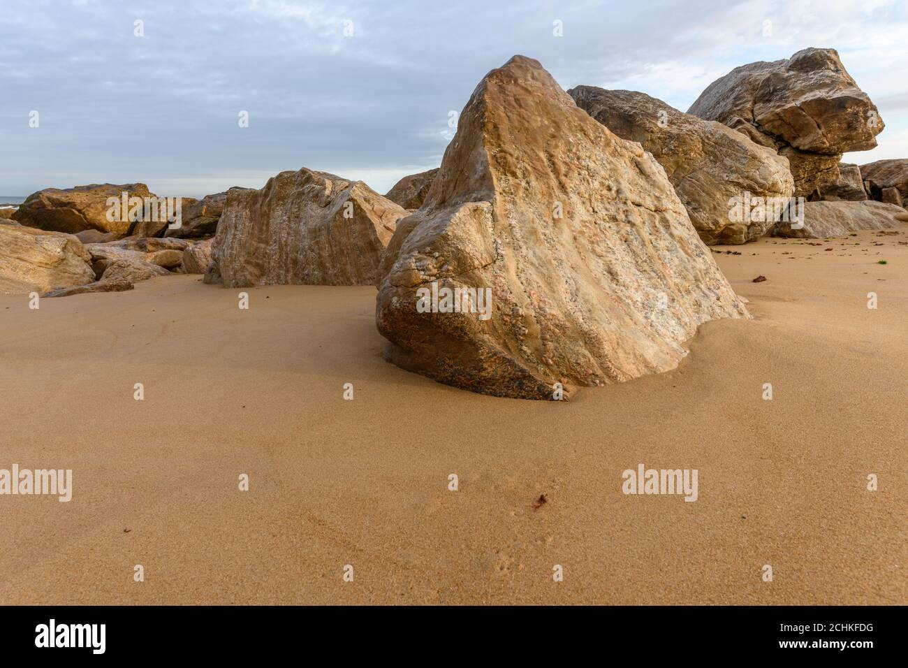 Sand beach among rocks in a summer morning in France Stock Photo - Alamy