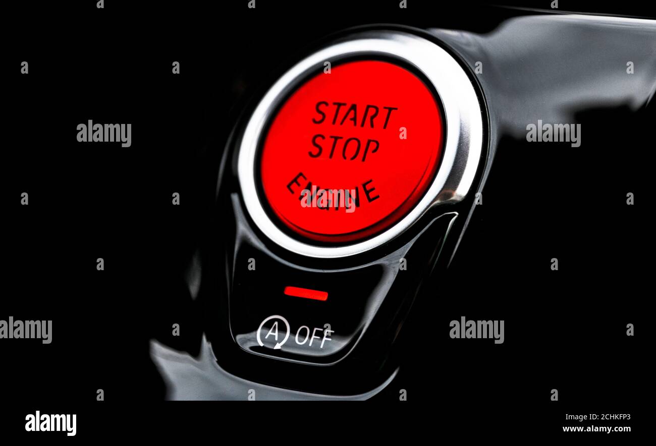 Car dashboard with focus on red engine start stop button. Modern car ...
