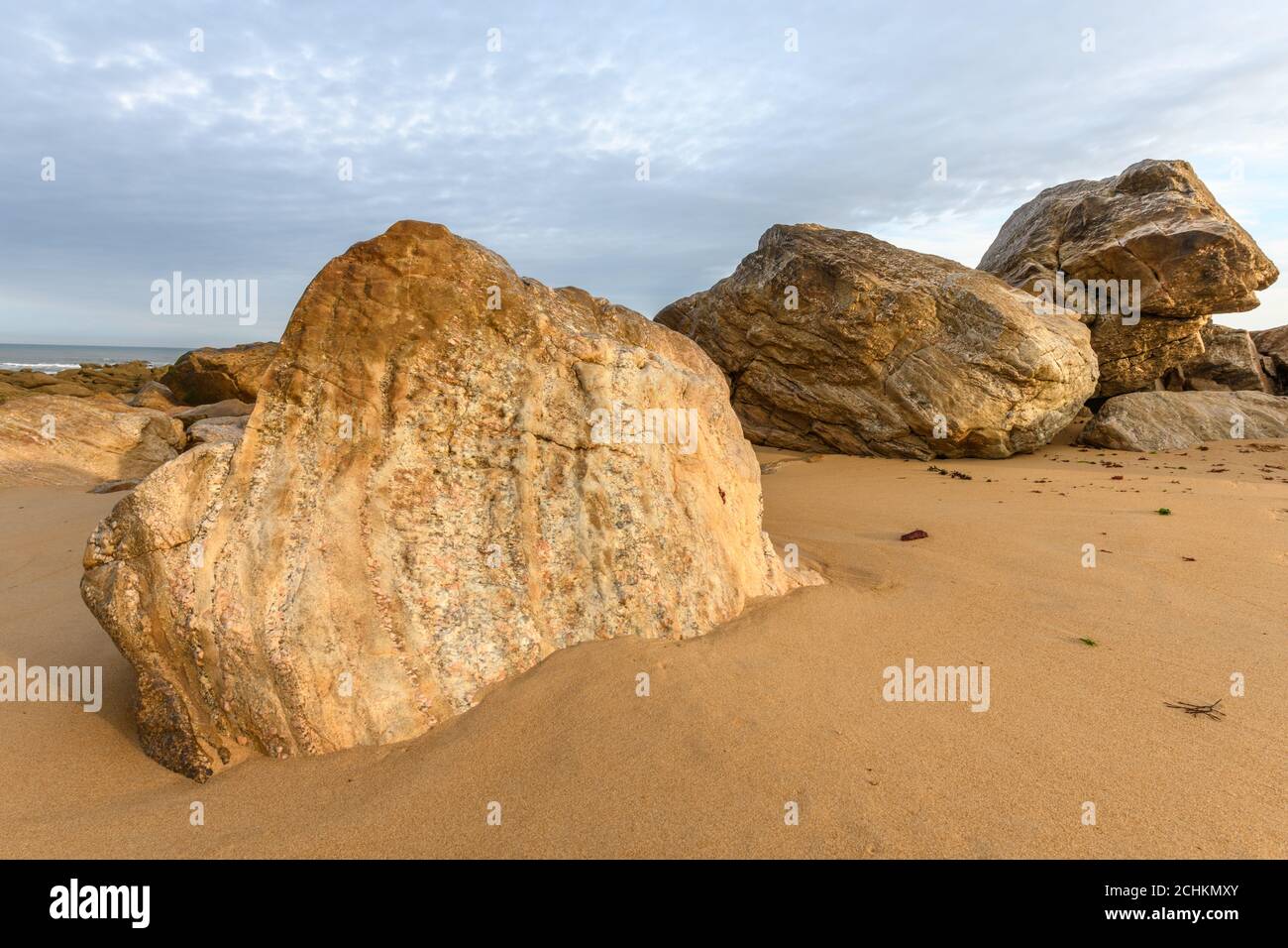 Sand beach among rocks in a summer morning in France Stock Photo - Alamy