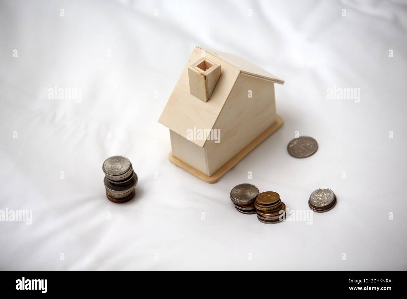 house shaped coin bank in the living room Stock Photo - Alamy
