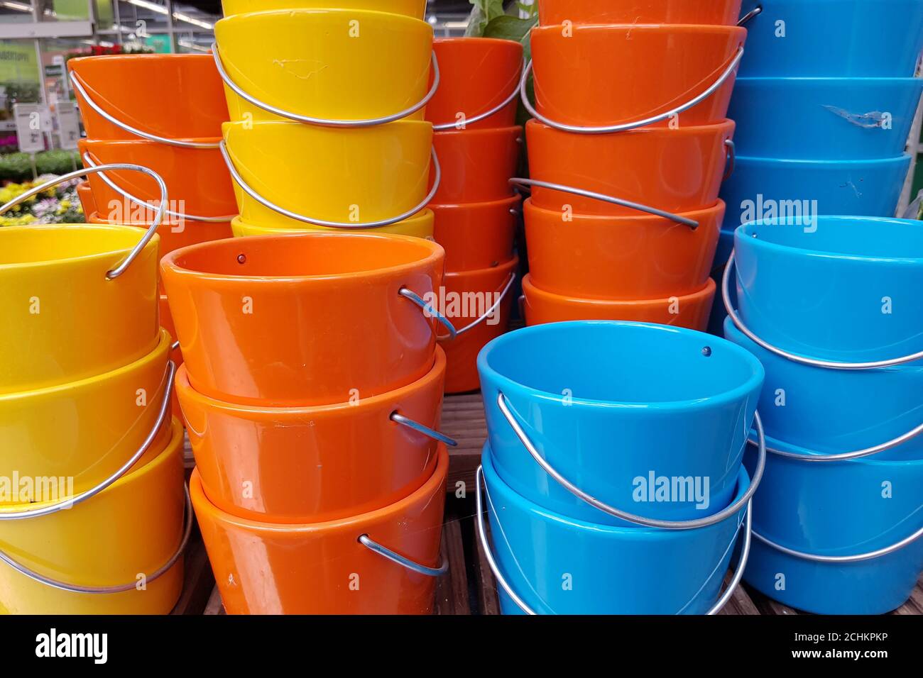 Closeup shot of bright-colored buckets piled according to colors Stock ...