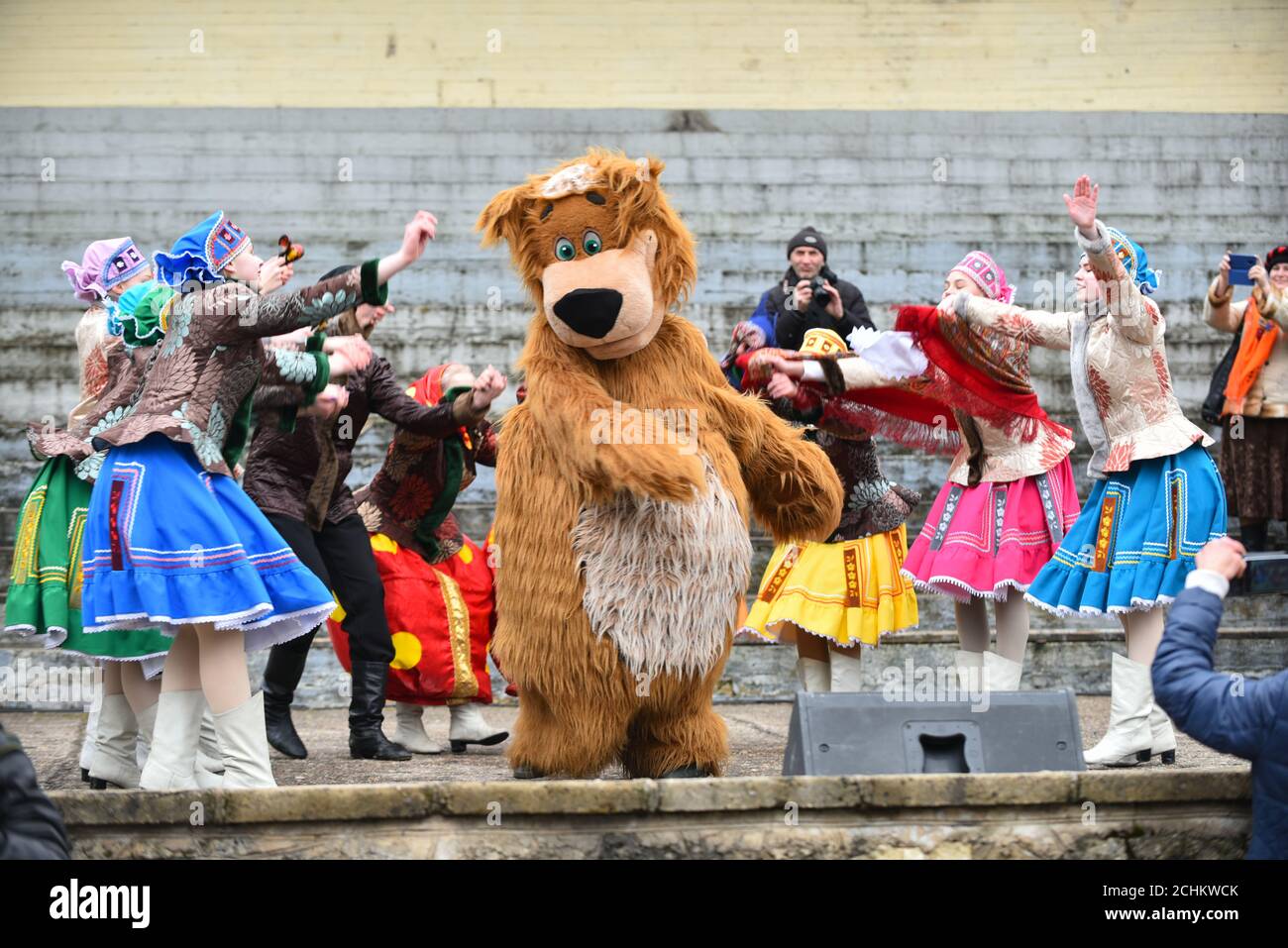 Russian ethnic carnival Maslenitsa - Pancake week. Bear woke up after a ...