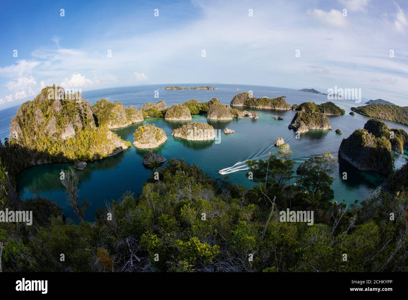 Beautiful limestone islands lie scattered amid Raja Ampat's tropical ...