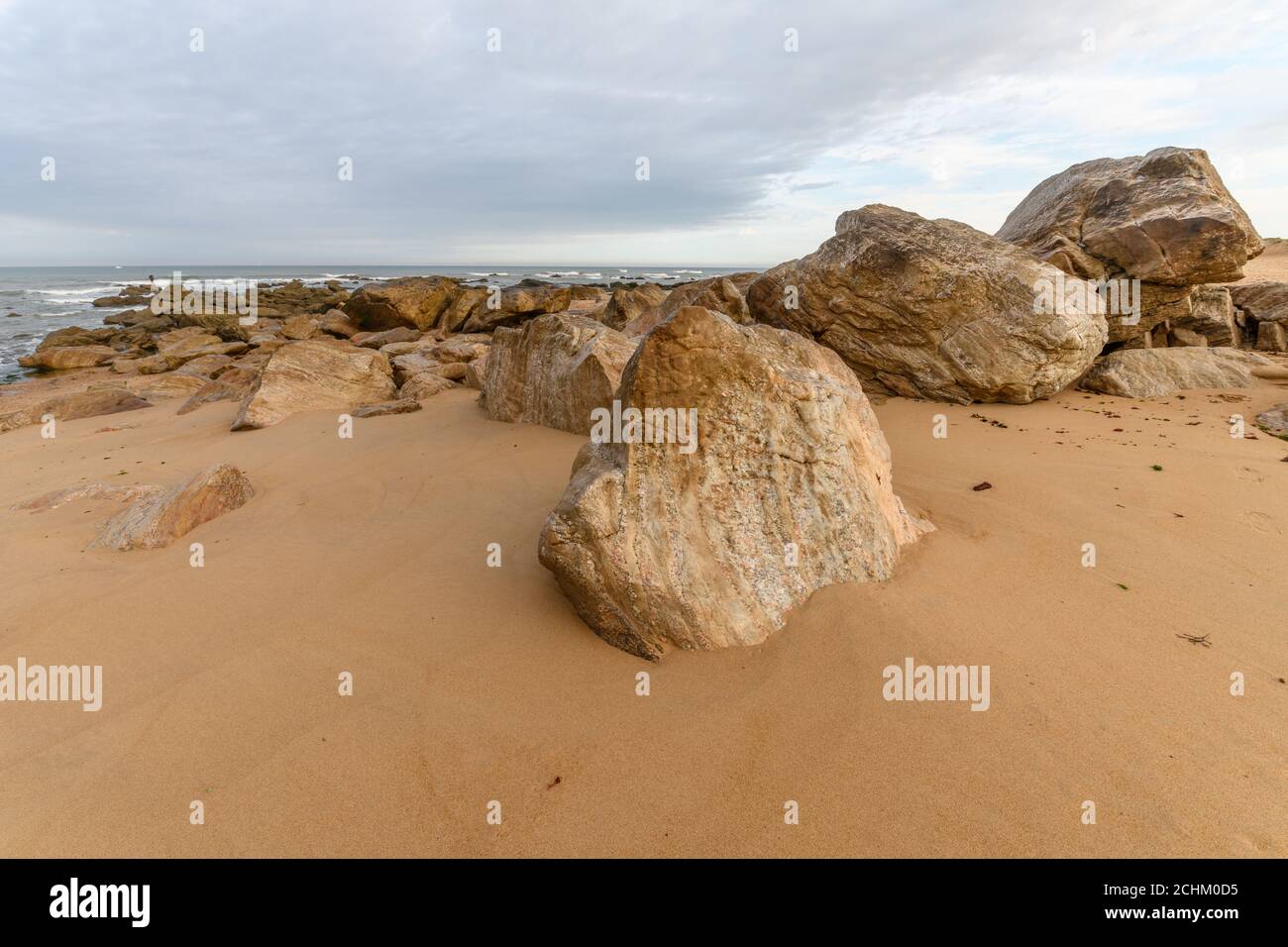 Sand beach among rocks in a summer morning in France Stock Photo - Alamy