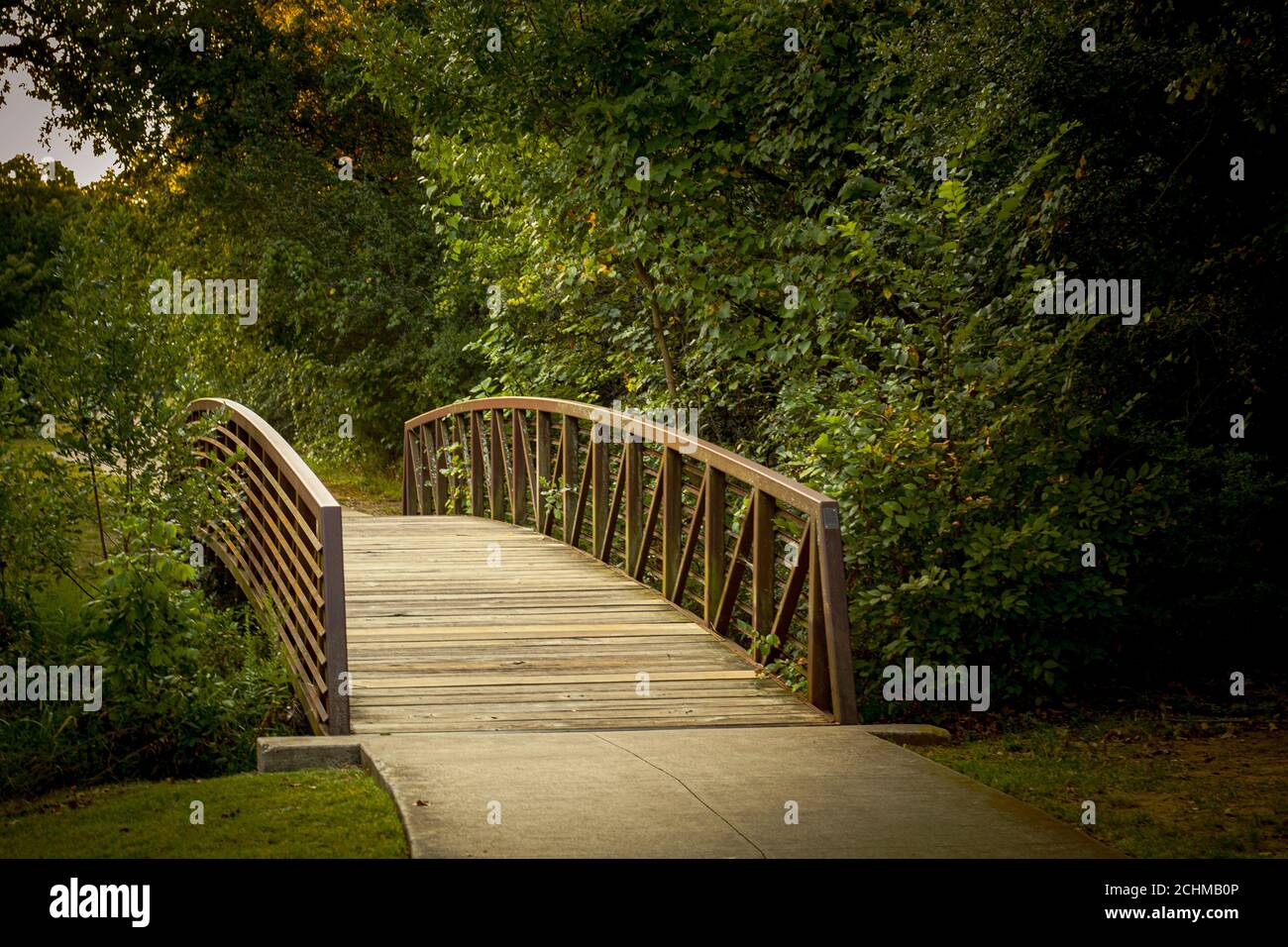 Rustic iron bridge walking path on fall day Stock Photo - Alamy