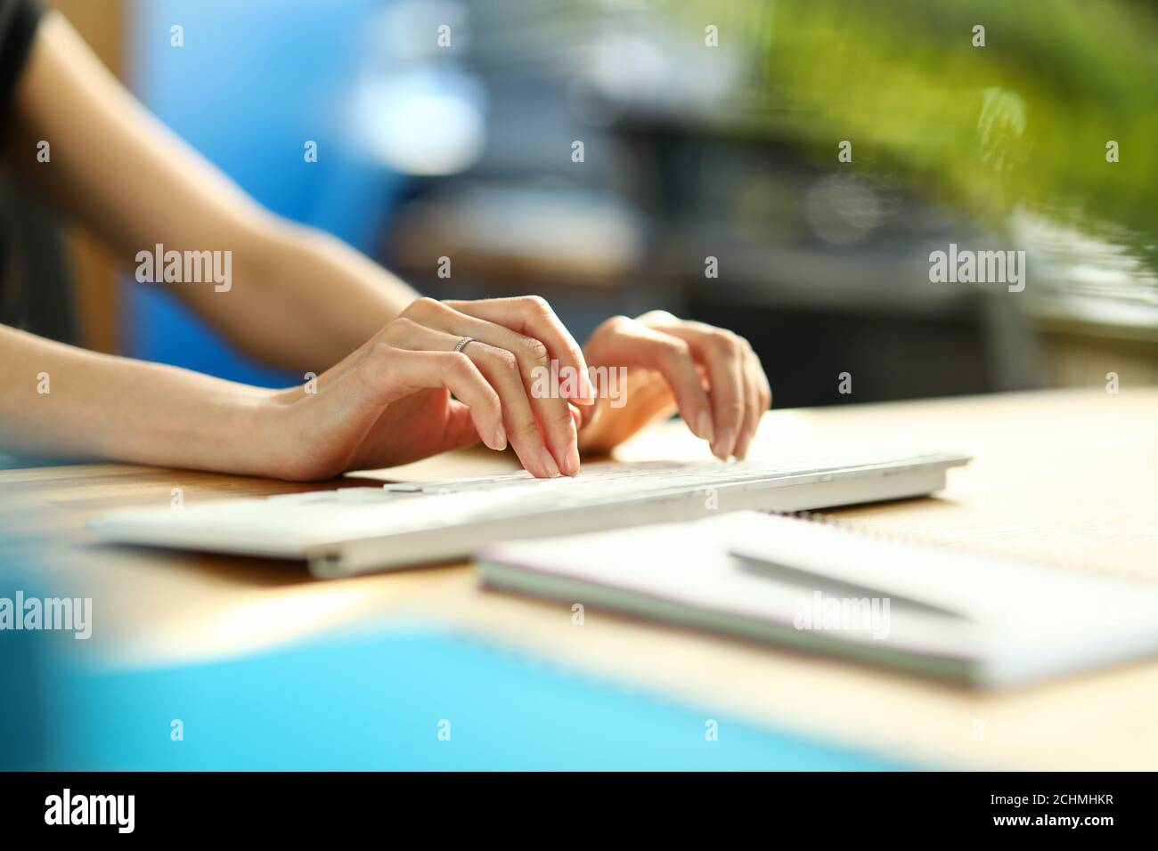 Young employee typing information hi-res stock photography and images ...