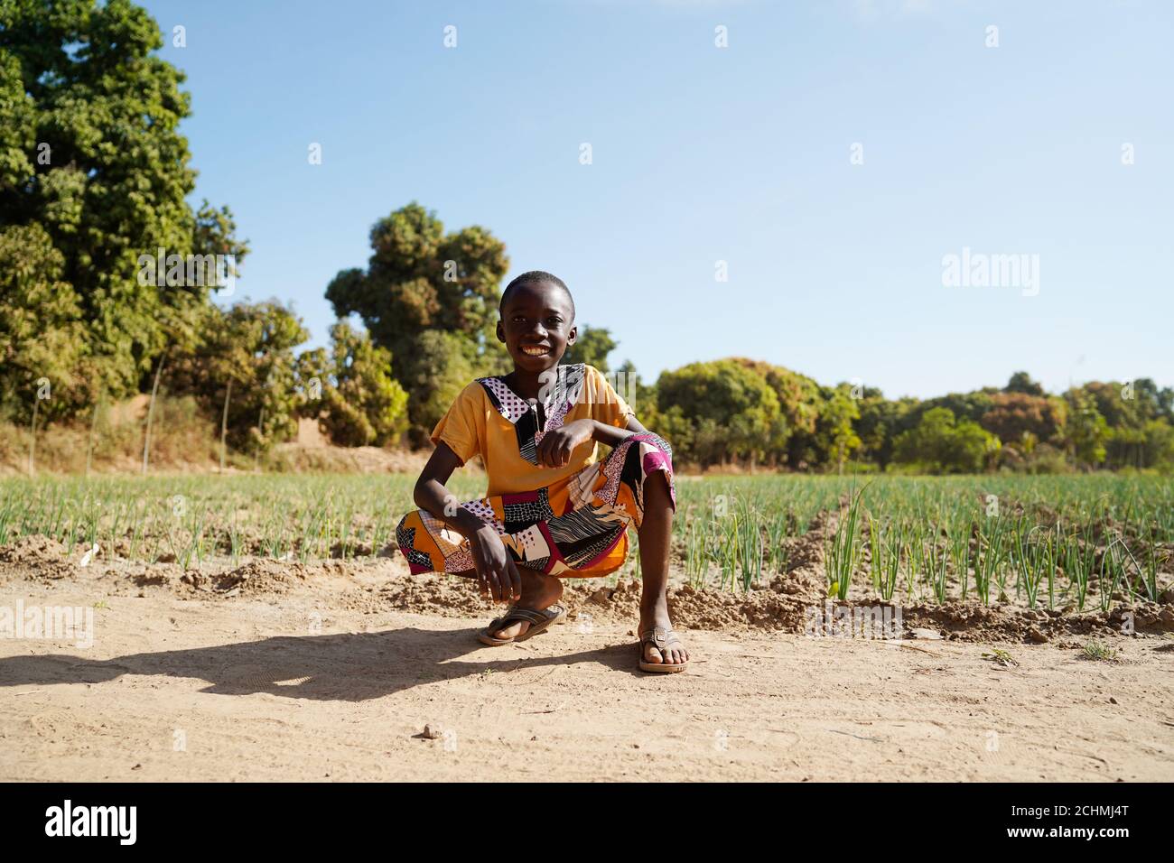 Proud Black African Ethnicity Child Posing Outdoors in front of ...