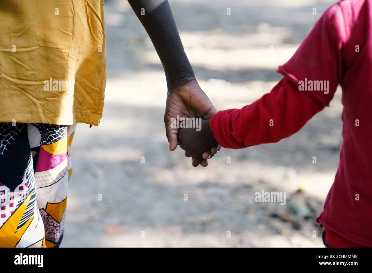 Two African Black Brothers Holding Hands Outdoors in Village near ...