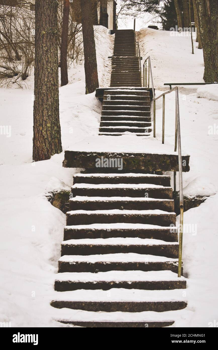 Winter. Stairs. People walk on a very snowy stairs. Uncleaned icy ...
