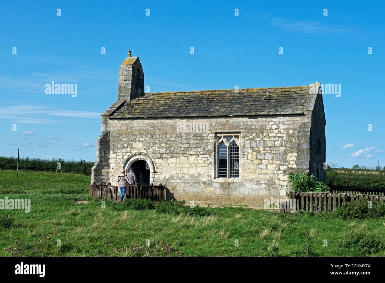 Couple entering St Mary's Church, Lead, now on its own in a field near ...