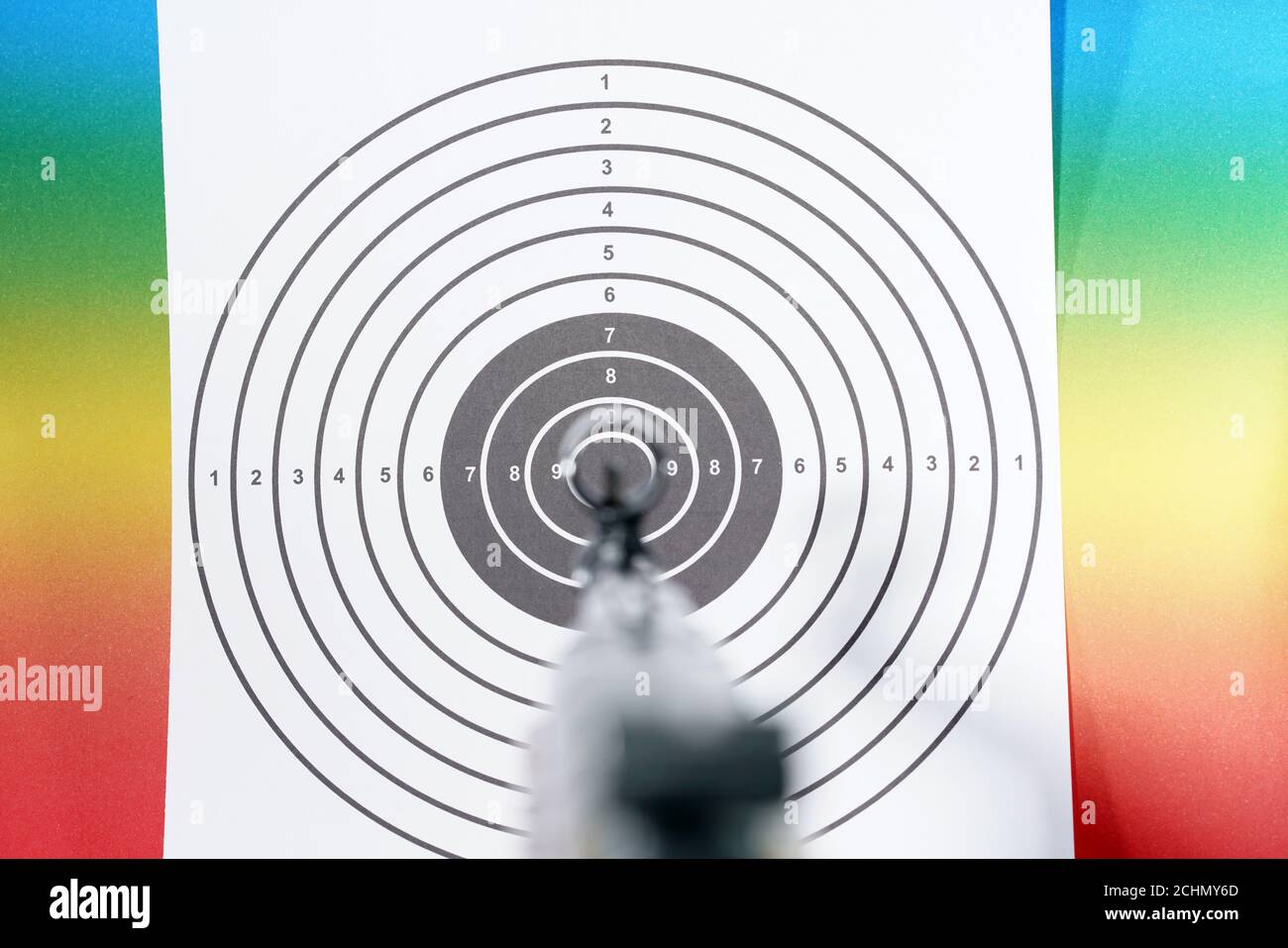 Selective focus shot of a rifle pointing to a shooting target on a ...