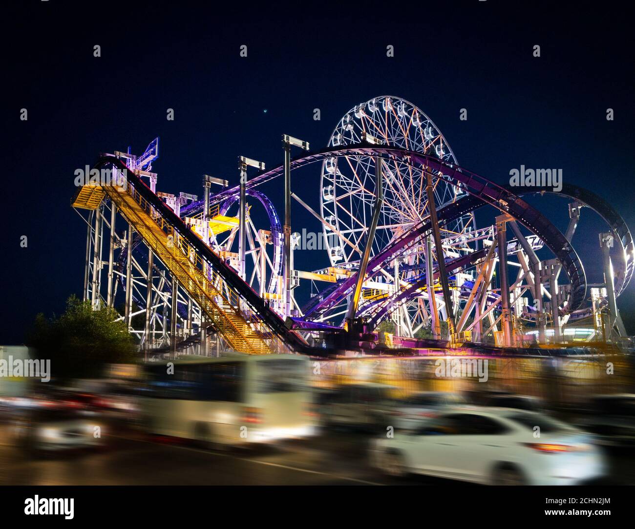 Classic Theme Park in night city Stock Photo - Alamy