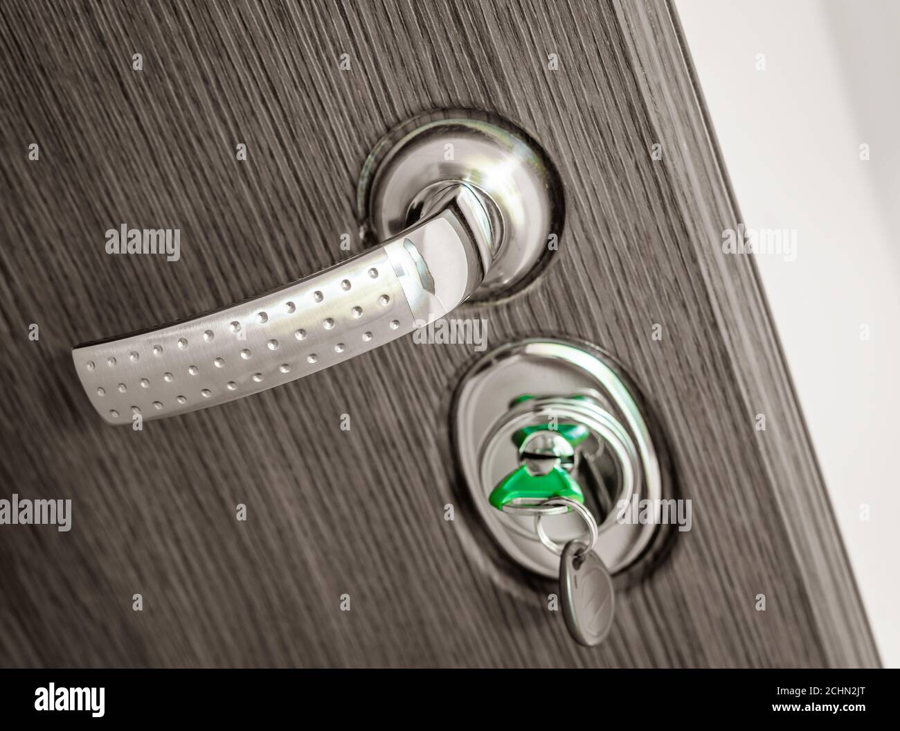 opened door handle with key in keyhole Stock Photo - Alamy