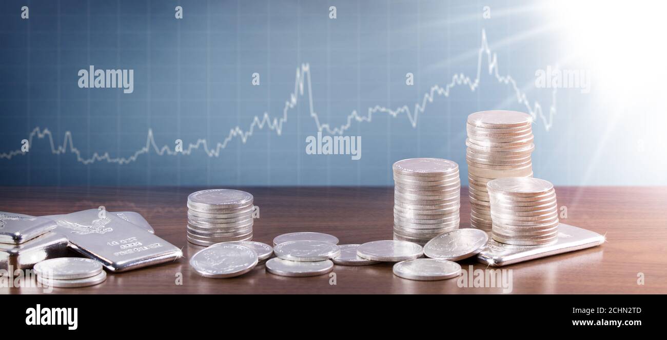 Silver bars and coins with price chart and light shining. Bright future ...