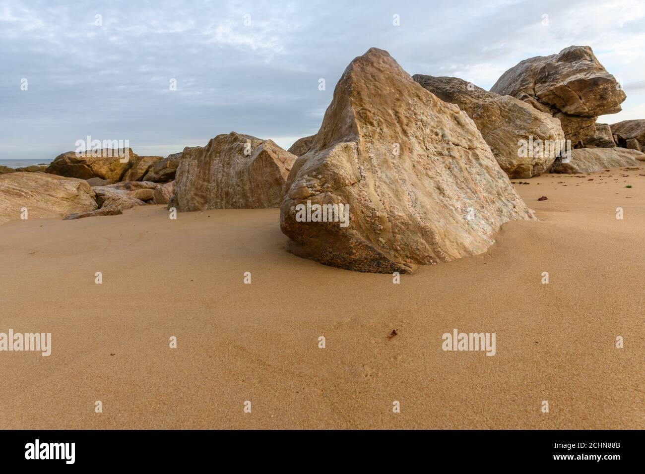 Sand beach among rocks in a summer morning in France Stock Photo - Alamy
