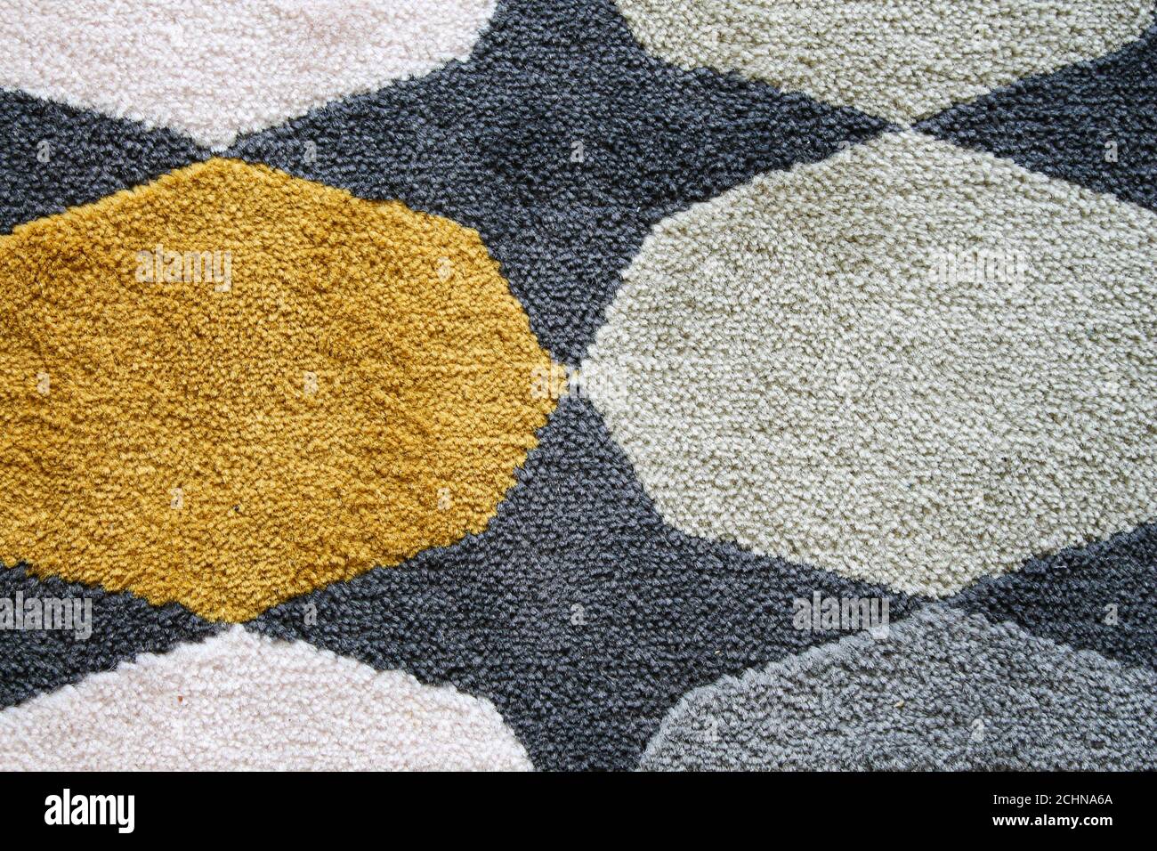 Multi-colored carpet with geometric shapes. Bedside carpet Stock Photo ...