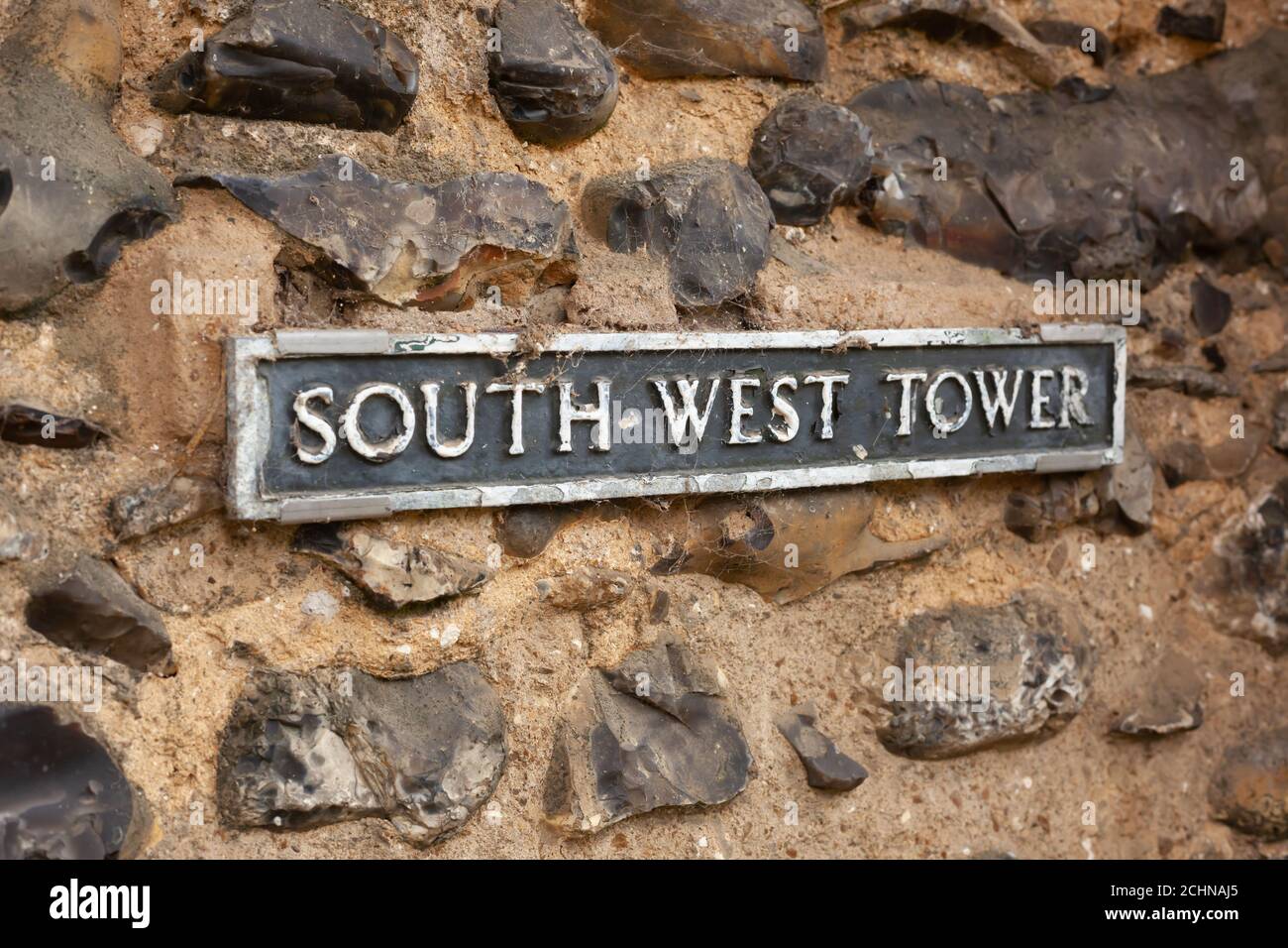 Britain's Heritage concept - South -West Tower sign fixed to flint ...