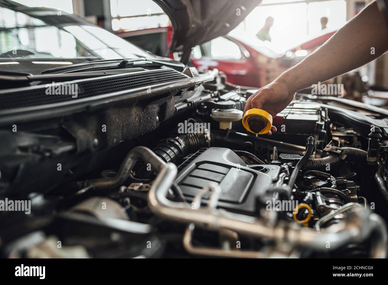 Auto mechanic working on a car engine, technical car inspection in ...