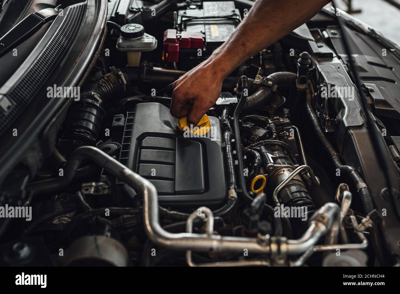 Auto mechanic working on a car engine, technical car inspection in ...