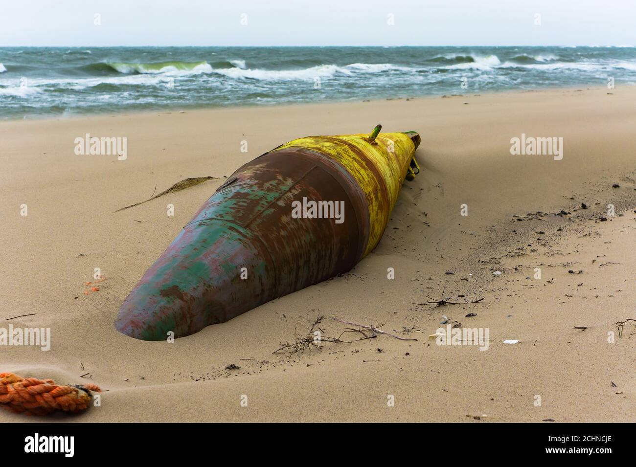 old iron float on the shore, sea buoy made of iron Stock Photo - Alamy