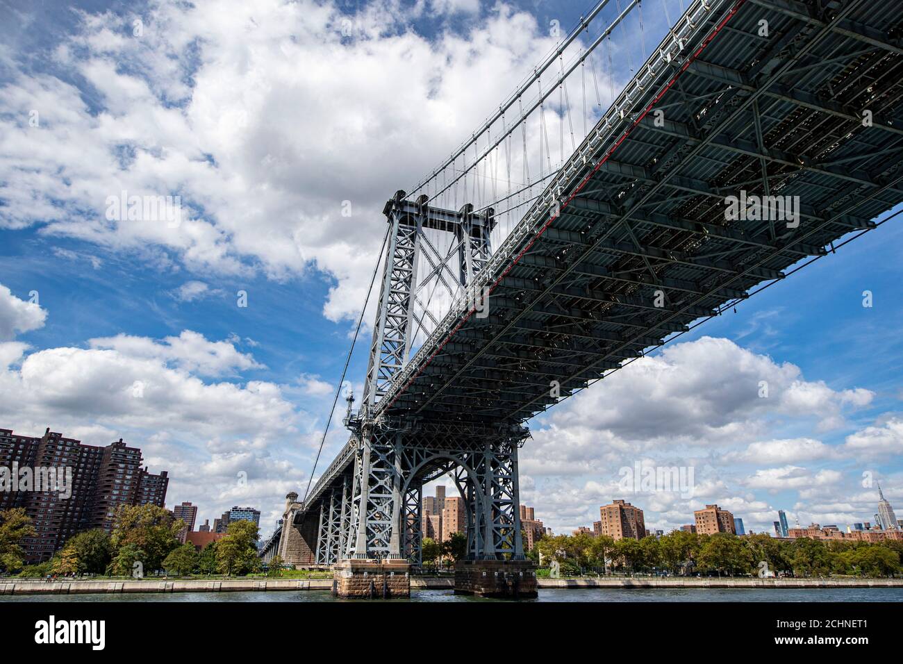 A view of Williamsburg Bridge from the East River in New York City on ...