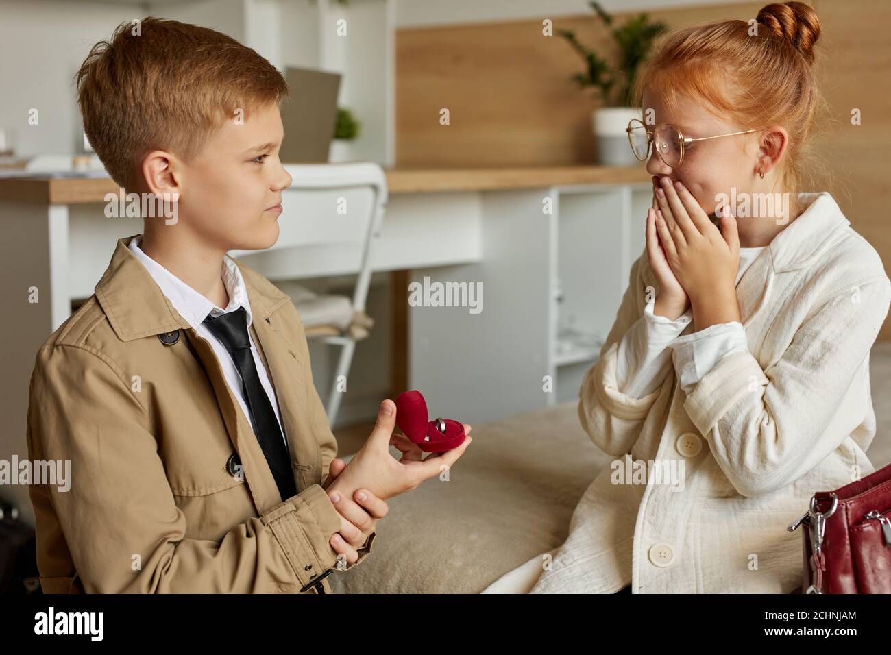 cute boy and girl going to be married, caucasian kid boy make proposal ...