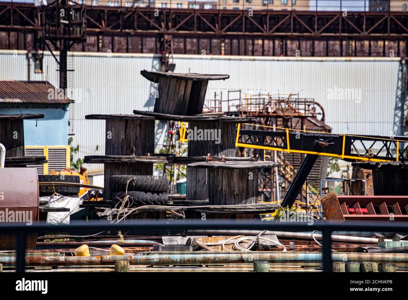 A view of the docks at the Brooklyn Navy Yard from the East River in ...
