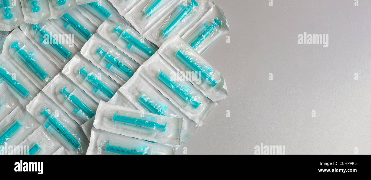 Medical syringes in a package. A bunch of unused, packaged syringes ...