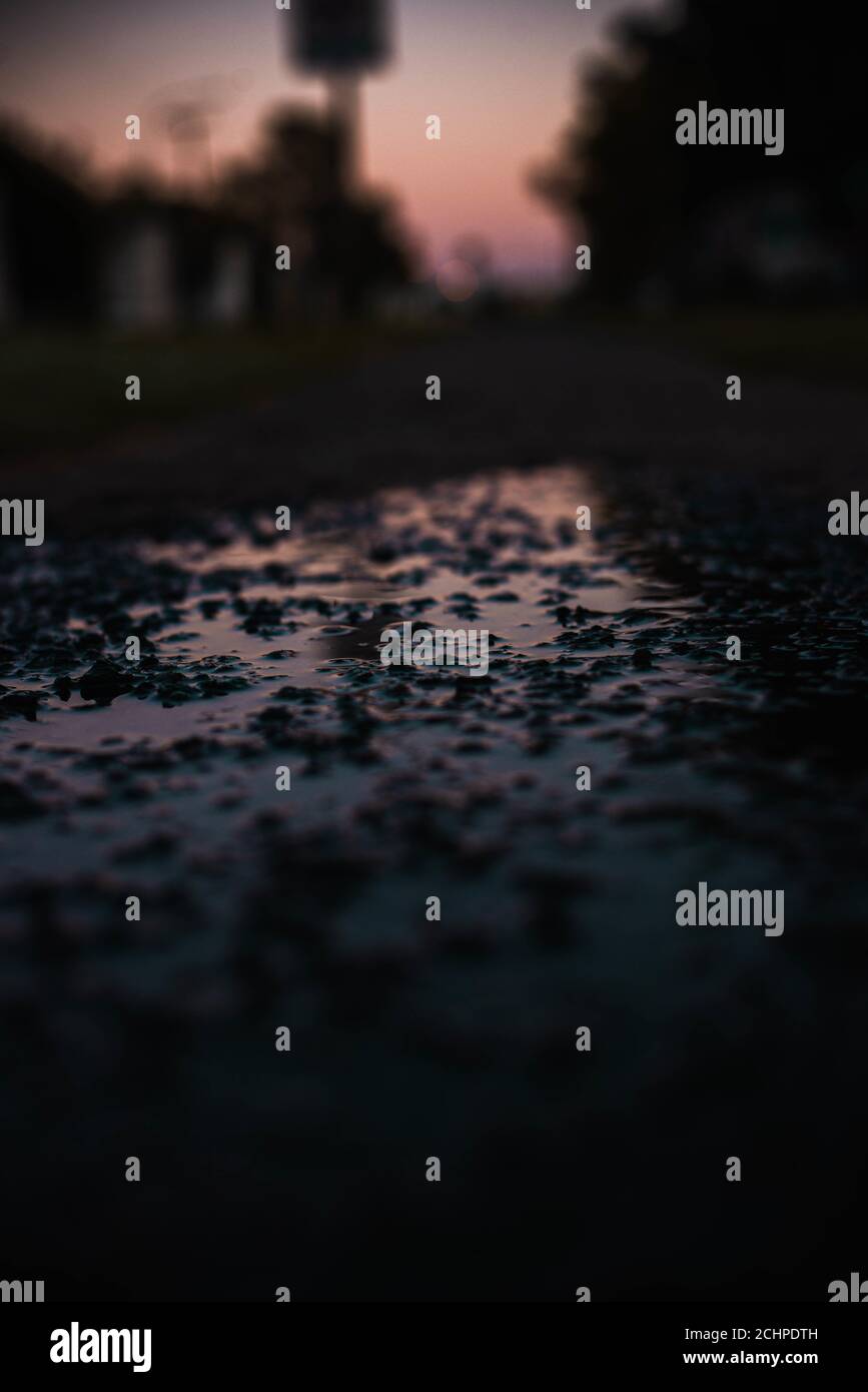 Mesmerizing view of a reflection of sunlight in a puddle of water Stock ...