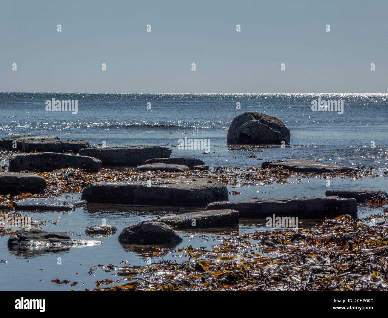 beautiful scene of rocks along the beach Stock Photo - Alamy