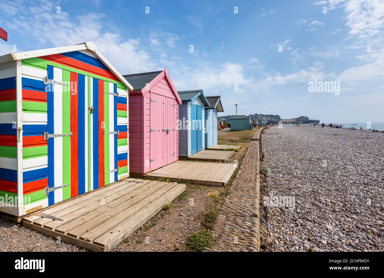 Typical seafront beach huts on the promenade at Budleigh Salterton, a ...