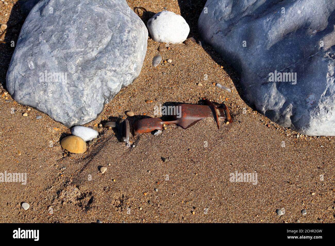 The wreckage of a vehicle partially buried in the sands of a beauty ...