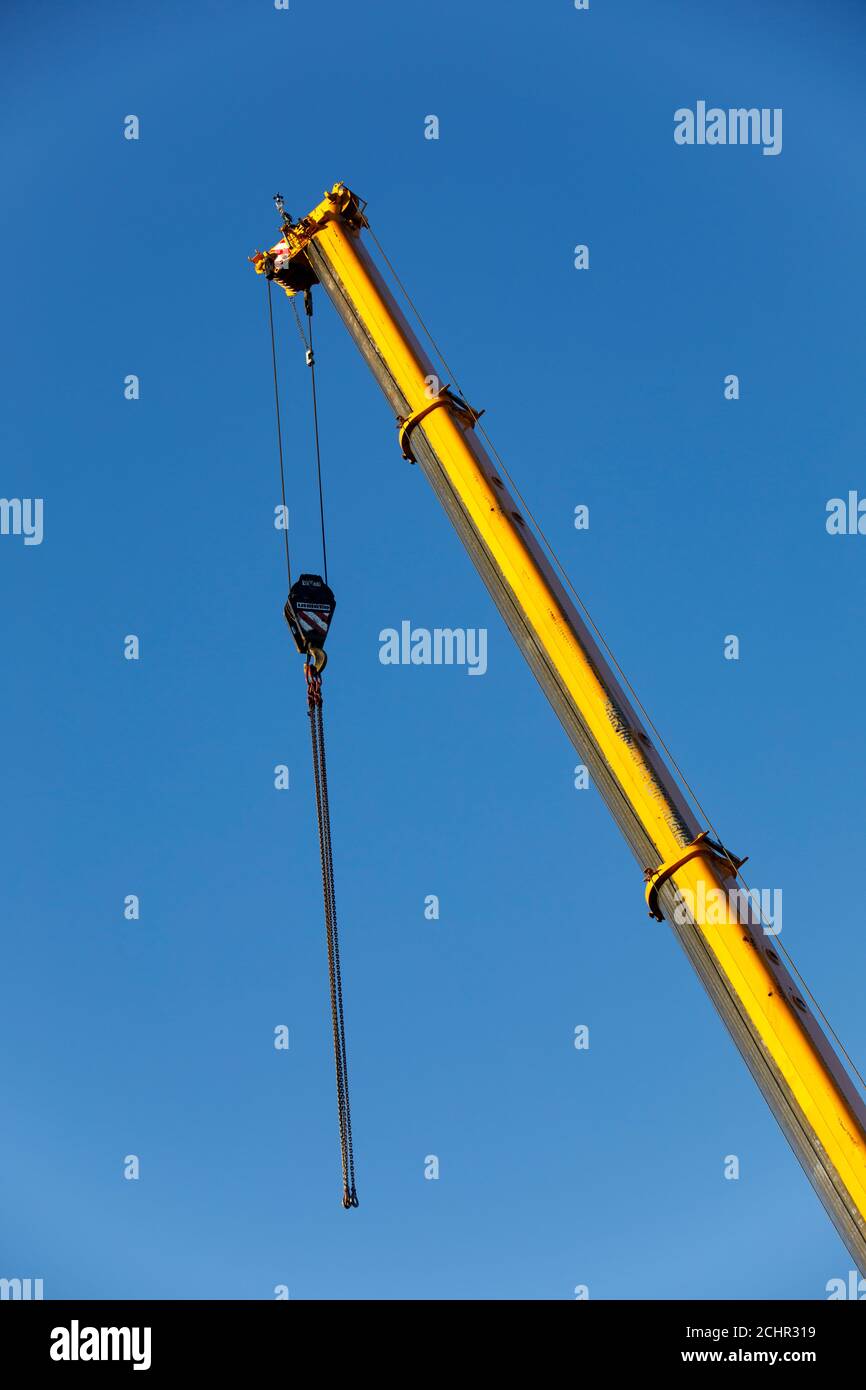 Side profile of an yellow extendable crane boom , Finland Stock Photo ...