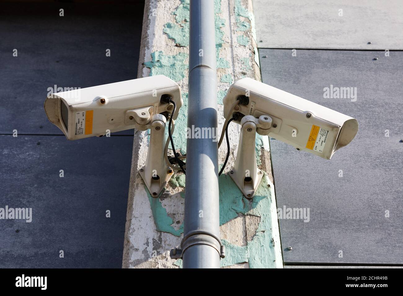 Two surveillance cameras pointing in opposite directions Stock Photo ...