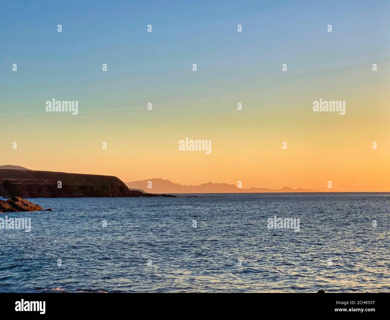 Fascinating scene of a sea on at the sunset Stock Photo - Alamy