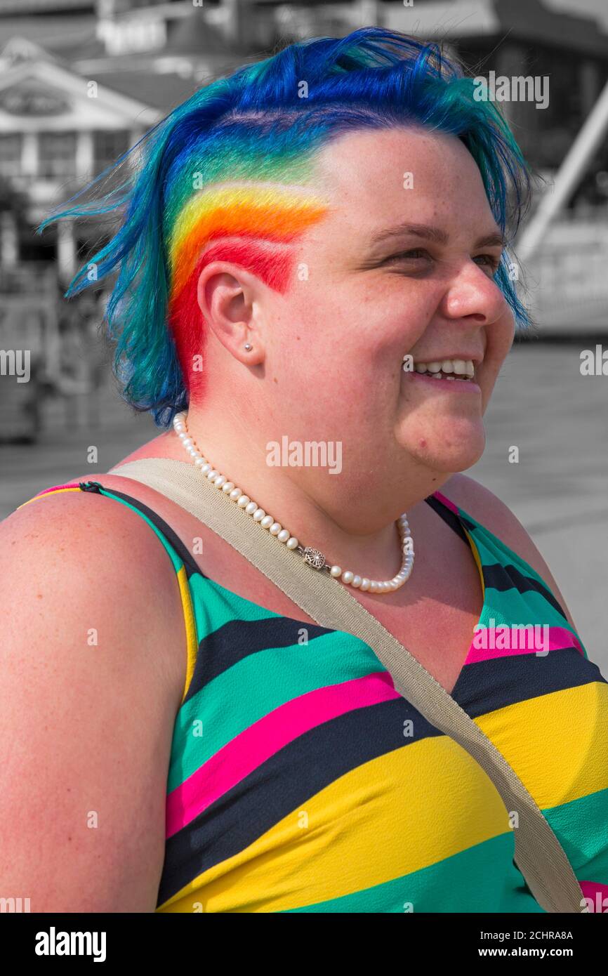 Zoe adds a splash of colour with rainbow coloured hair and dress at ...