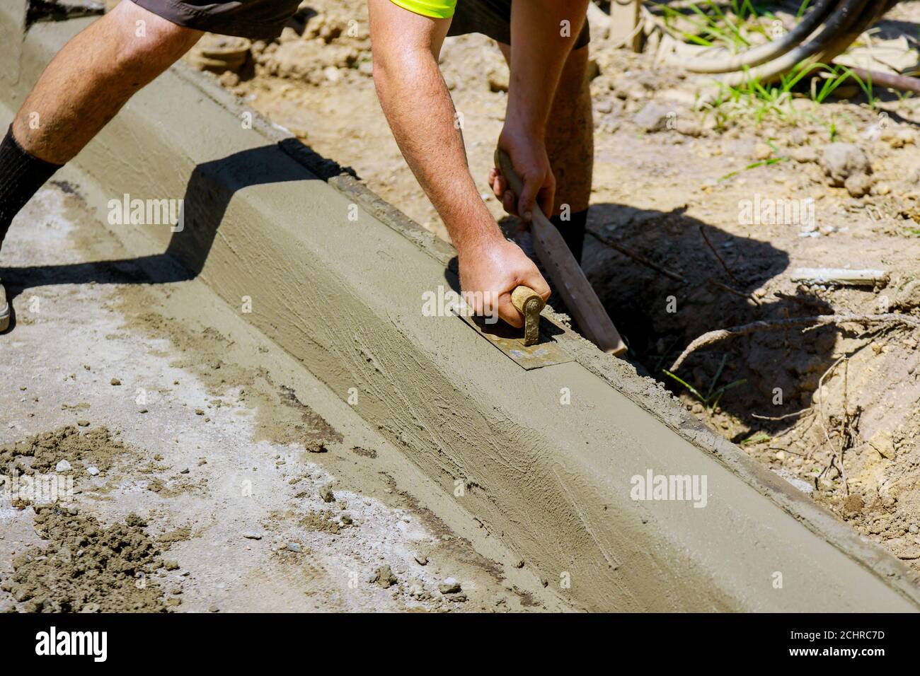The process of construction of the sidewalk, the installation of under ...