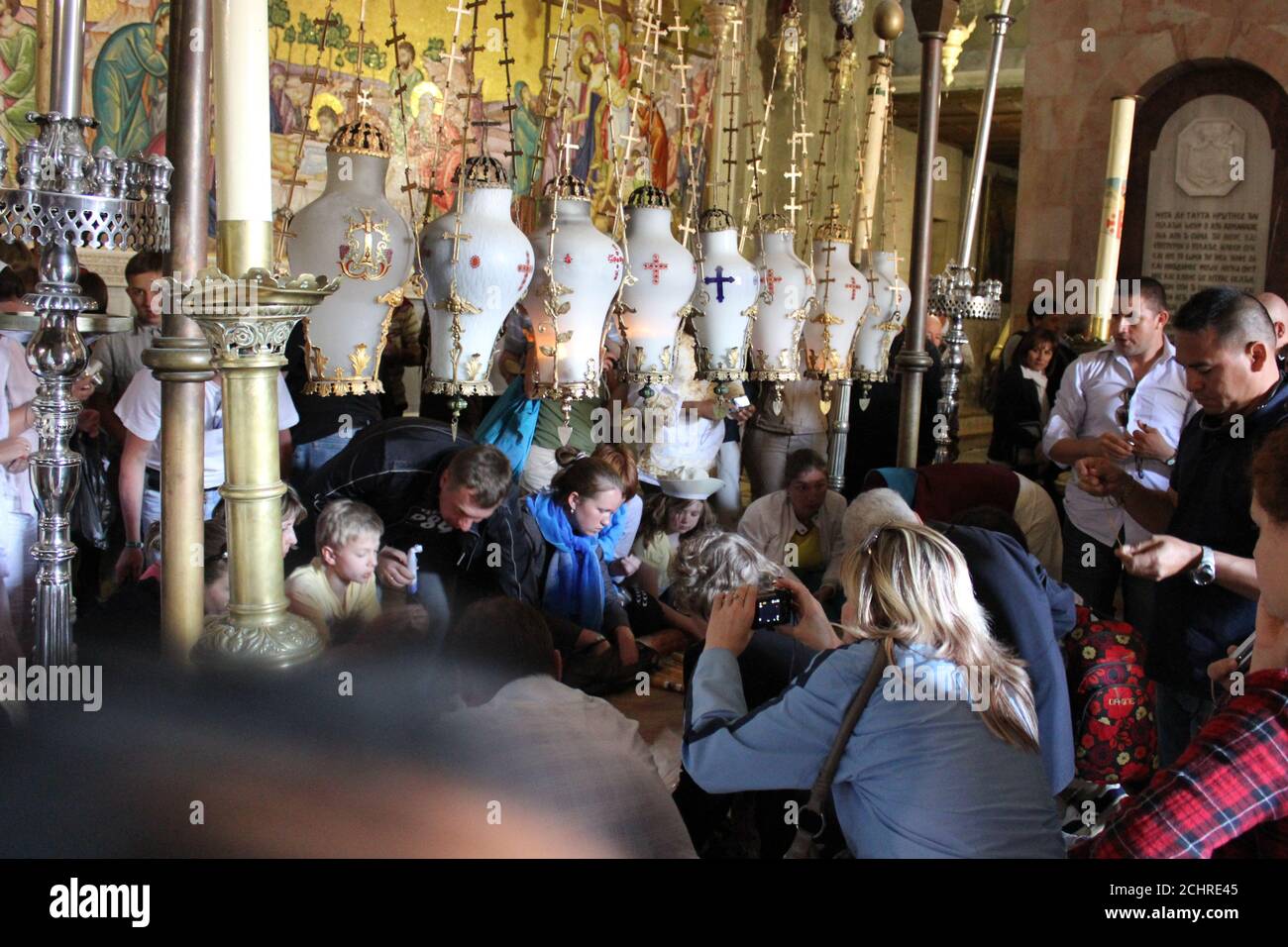Rubbing the anointing stone in Golgotha Church of the Holy Sepulchre ...