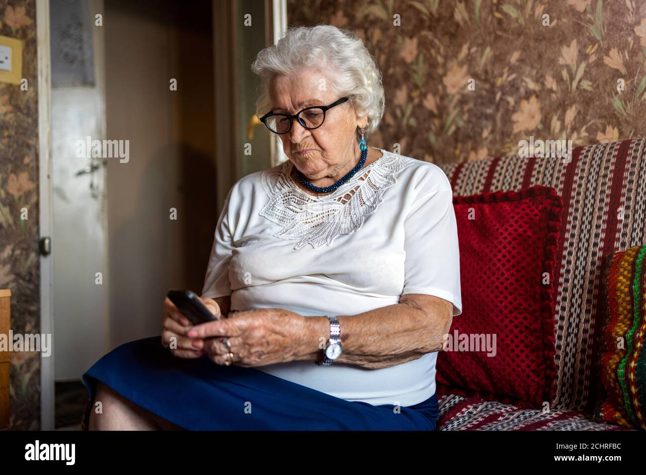 Mature woman using phone unhappy hi-res stock photography and images ...