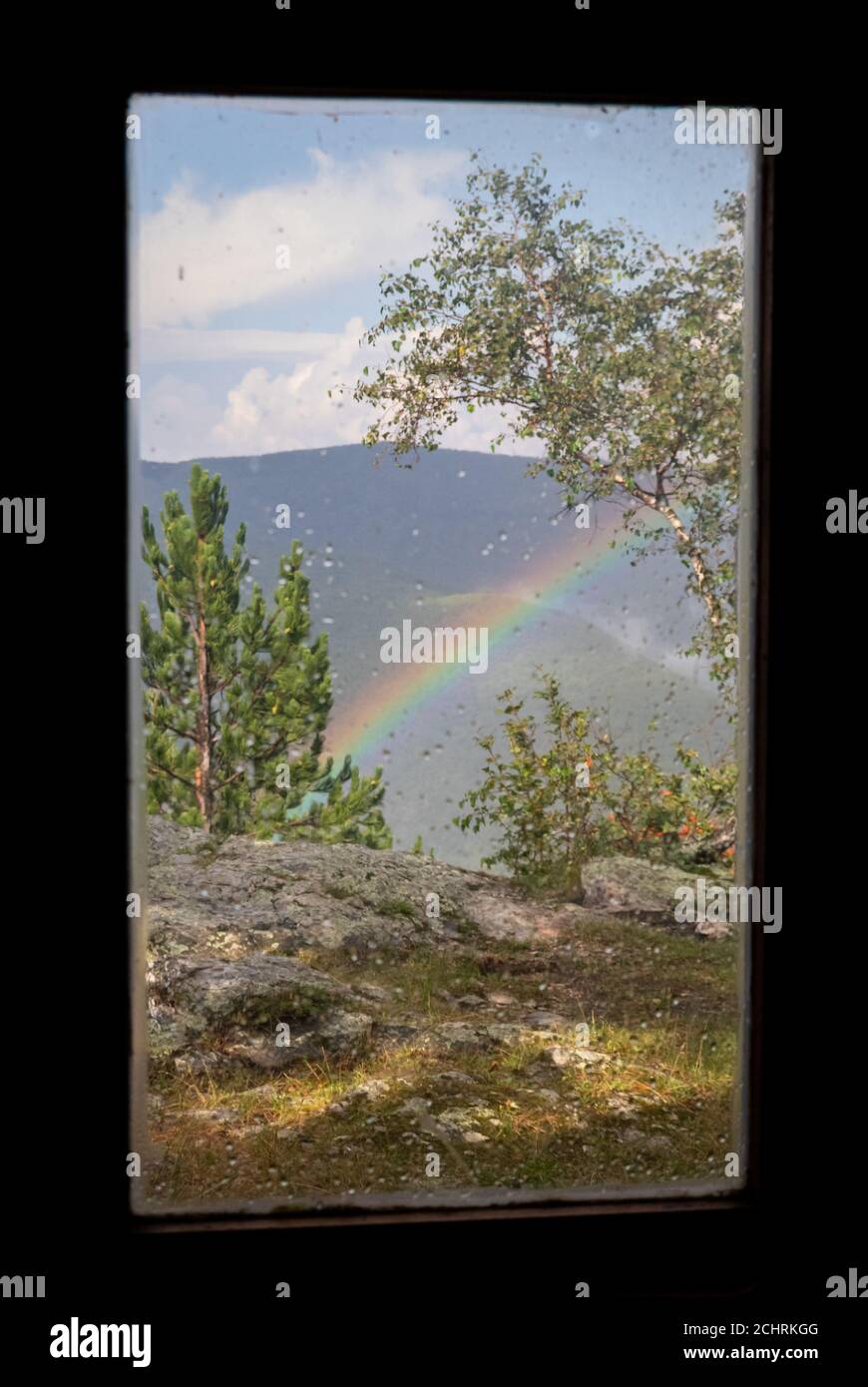 Beautiful view of a rainbow through a rained window with droplets Stock ...