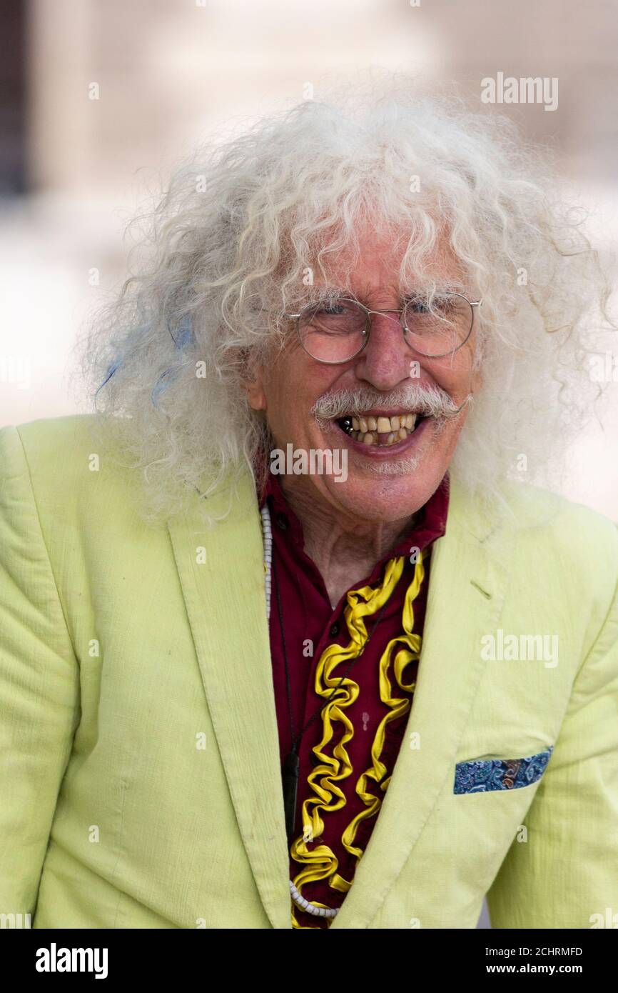 Portrait of an elderly man smiling during an Extinction Rebellion ...