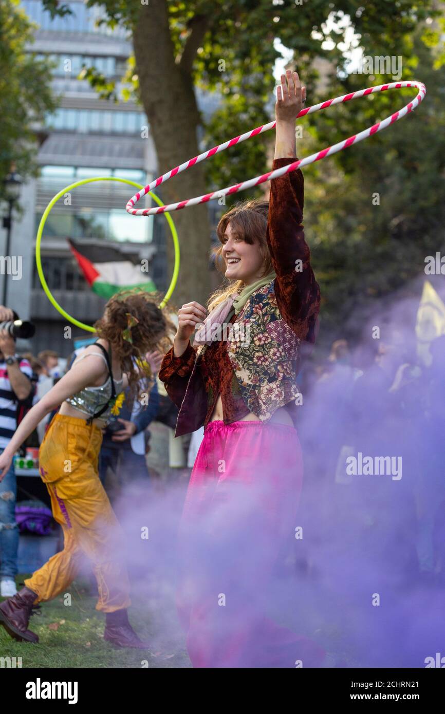 Hula hoop dancing at an Extinction Rebellion demonstration, Parliament ...