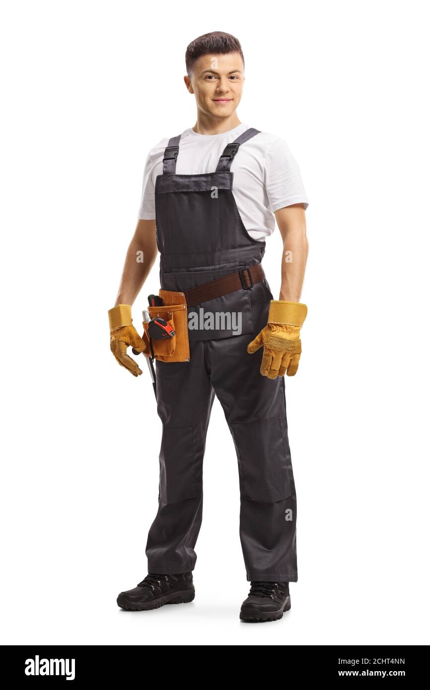 Full length portrait of a young repairman with a tool belt in a gray ...